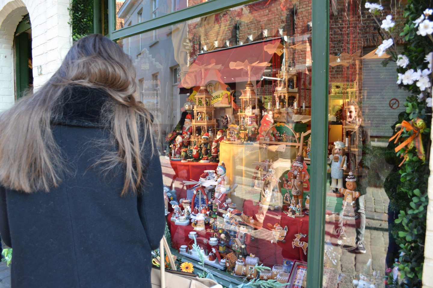 Natalie enjoying the chocolate view in the chocolatier's window, Bruges ...